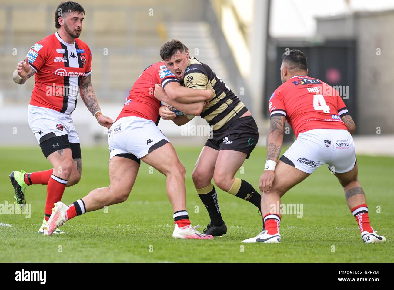 Craig Mullen (22) of Leigh Centurions is tackled by Krisnan Inu (4) of ...