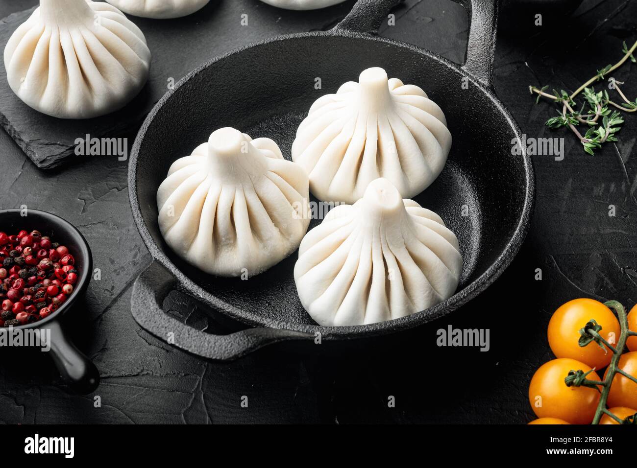 Homemade, traditional chinese pan fried dumplings set, in frying cast ...