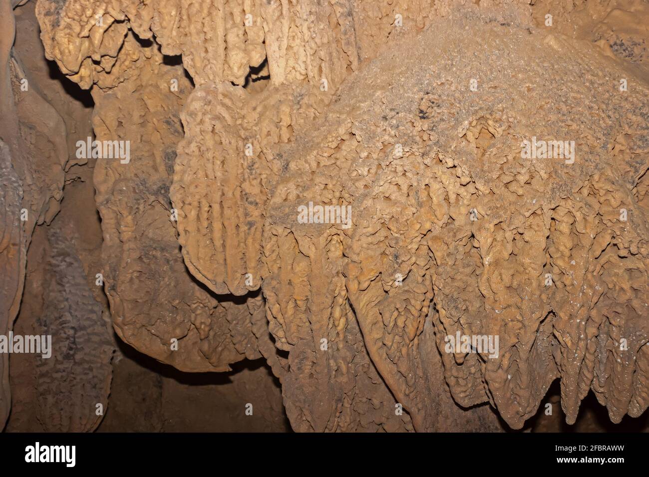 Speleology. Old cave washed by an underground river in the mountain ...