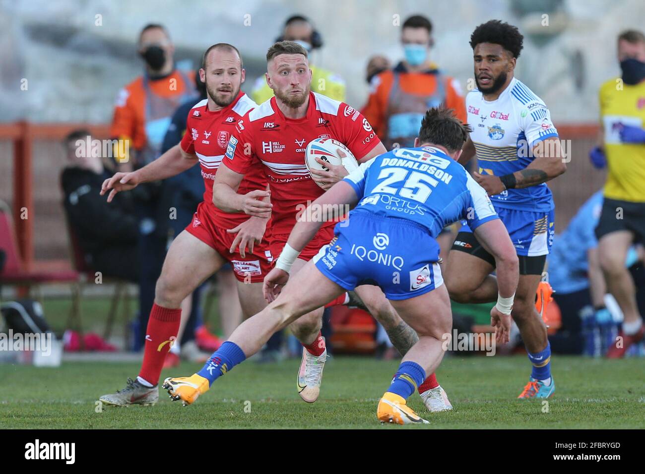 Ethan Ryan (23) of Hull KR runs at James Donaldson (25) of Leeds Rhinos ...