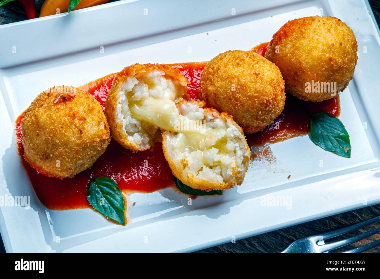 Fried rice balls. Traditional from Brazil where it is called Bolinho de ...