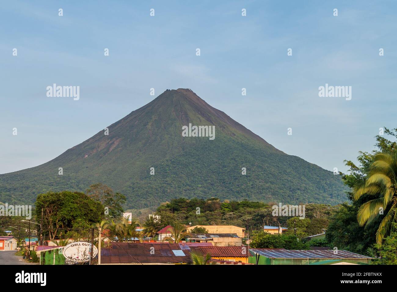 LA FORTUNA, COSTA RICA - MAY 8, 2016: Volcano Arenal soaring behind La ...