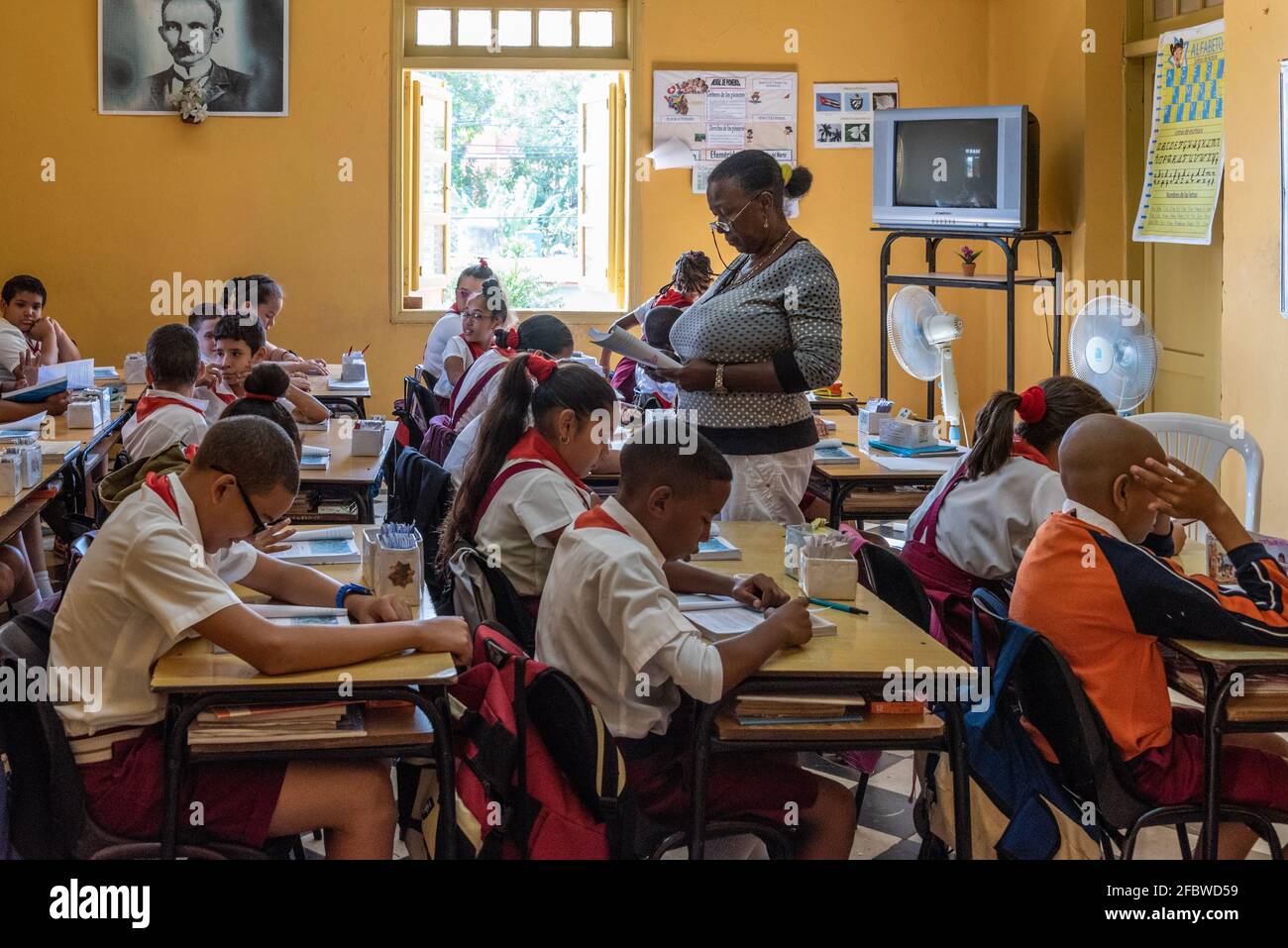 Cuban students pioneers in a classroom with a teacher, Santiago de Cuba ...