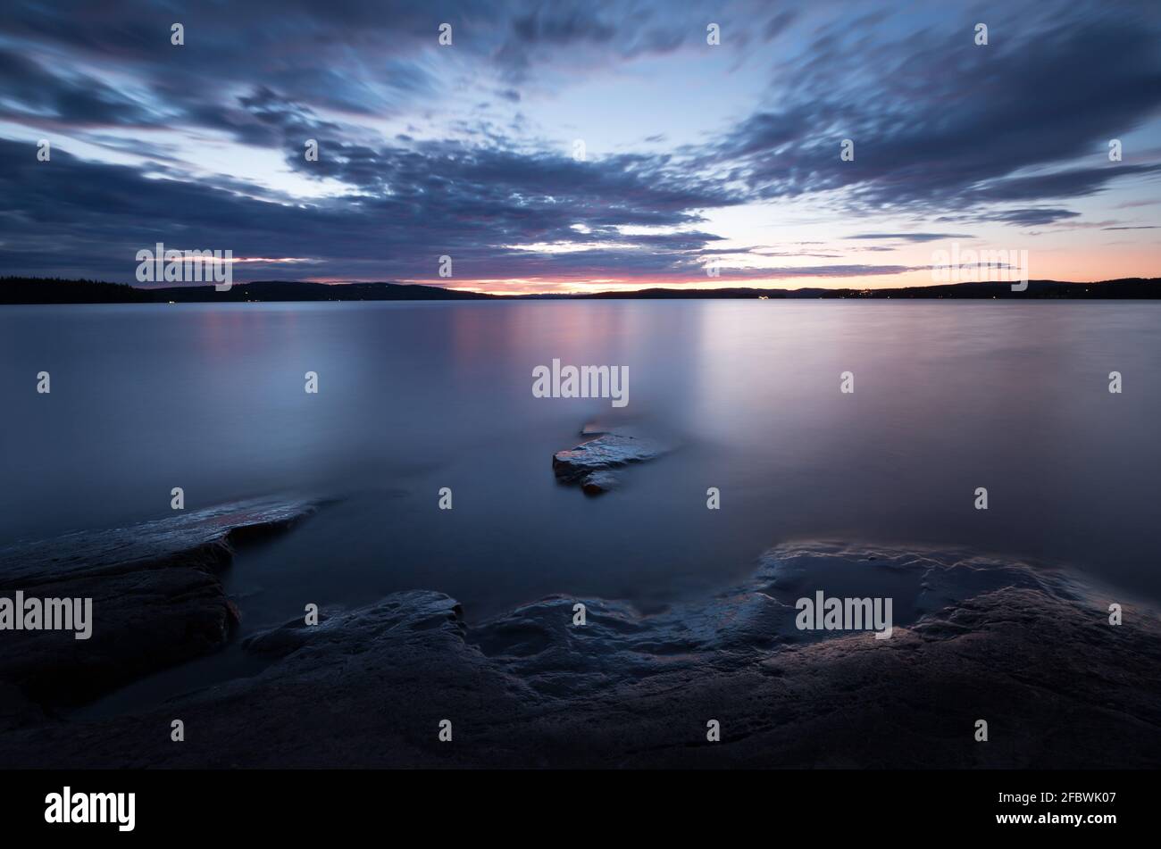 Beautiful twilight scene from a lake in sweden Stock Photo - Alamy
