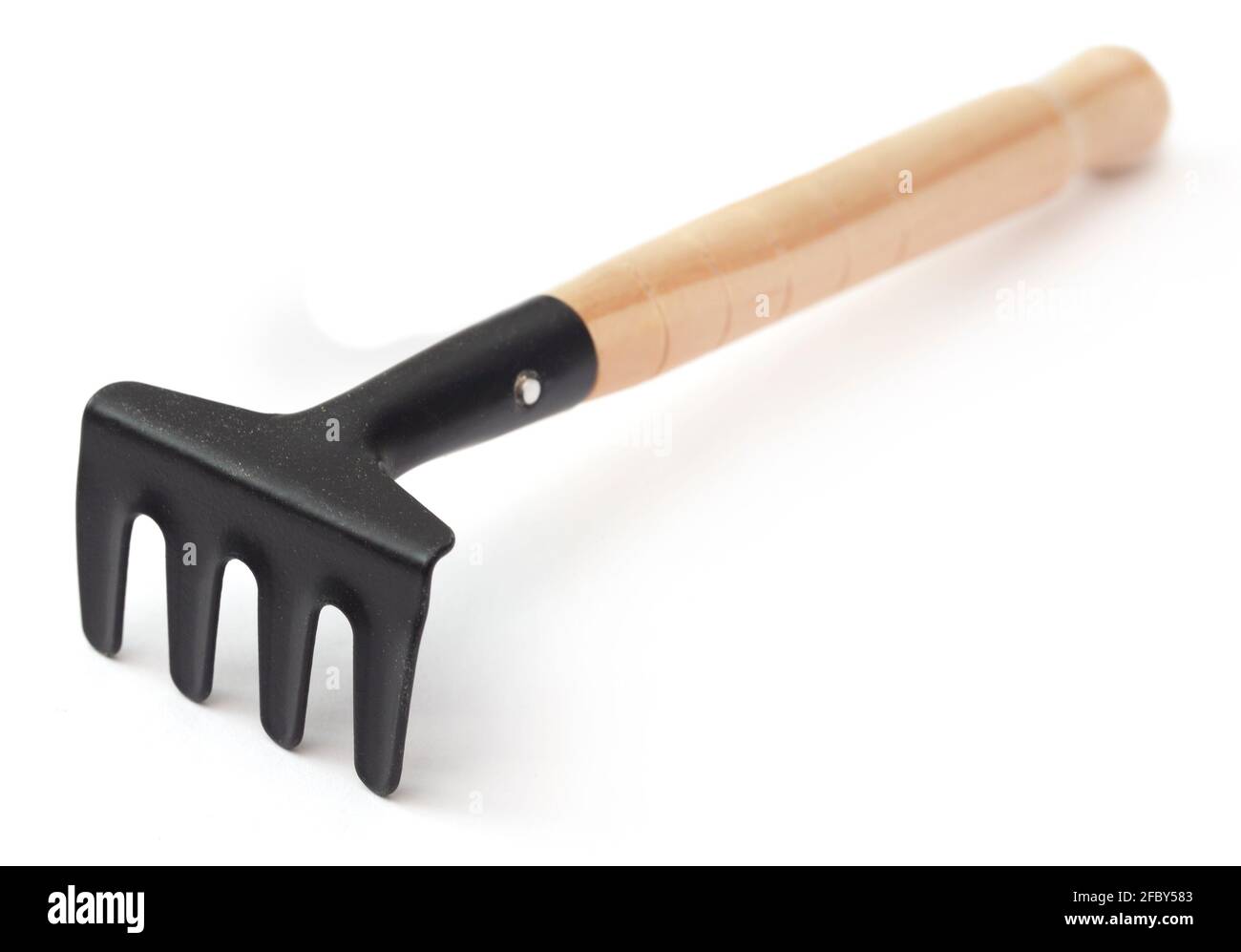Garden tool Rake over white background Stock Photo - Alamy