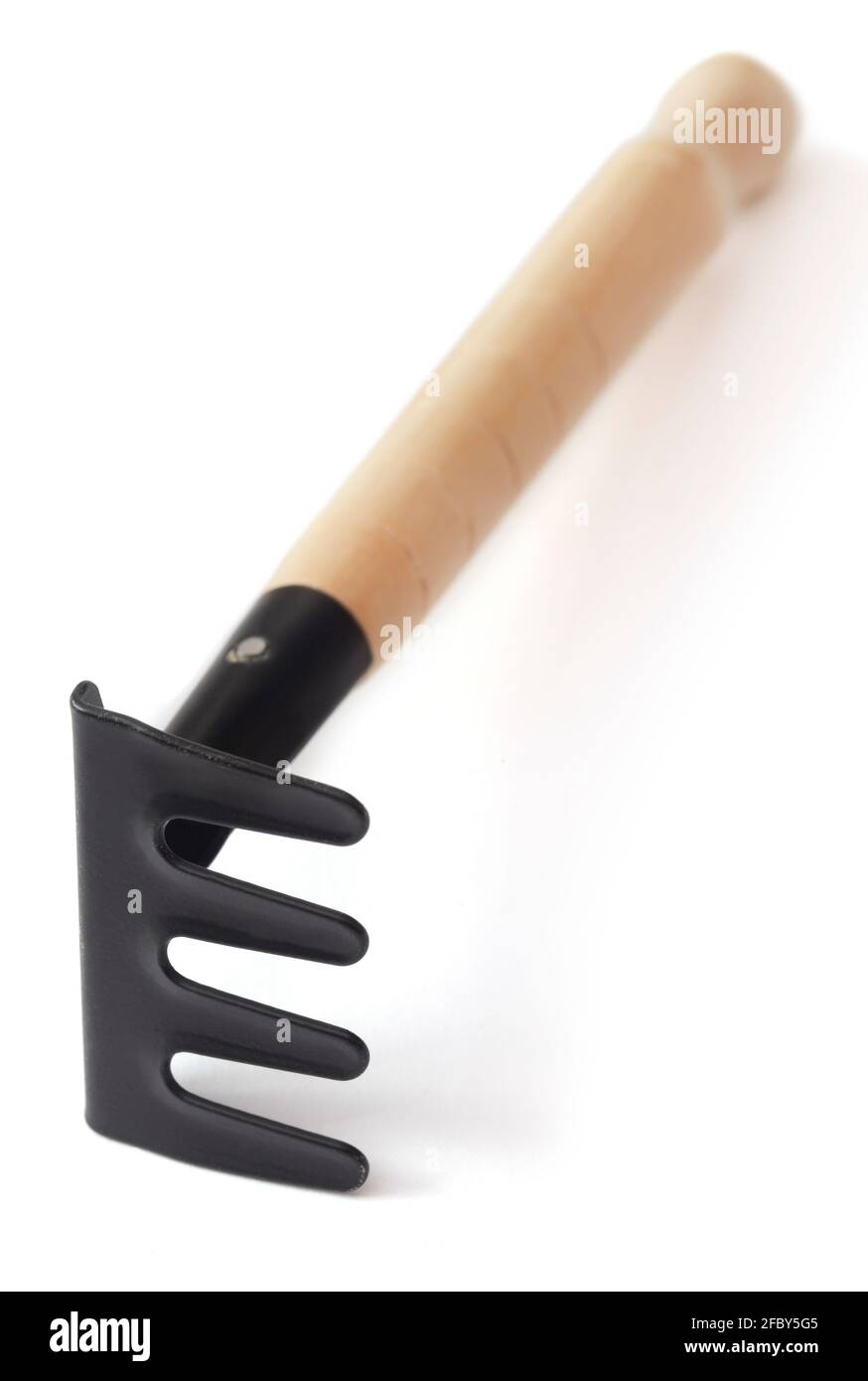 Garden tool Rake over white background Stock Photo - Alamy