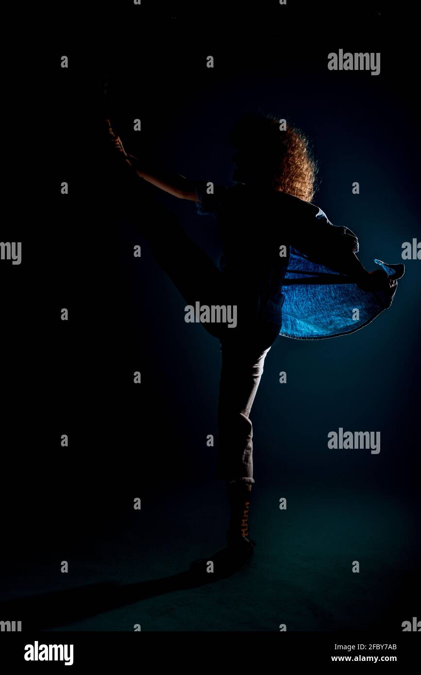 Contemporary dancing performer in a dance practice class isolated on ...