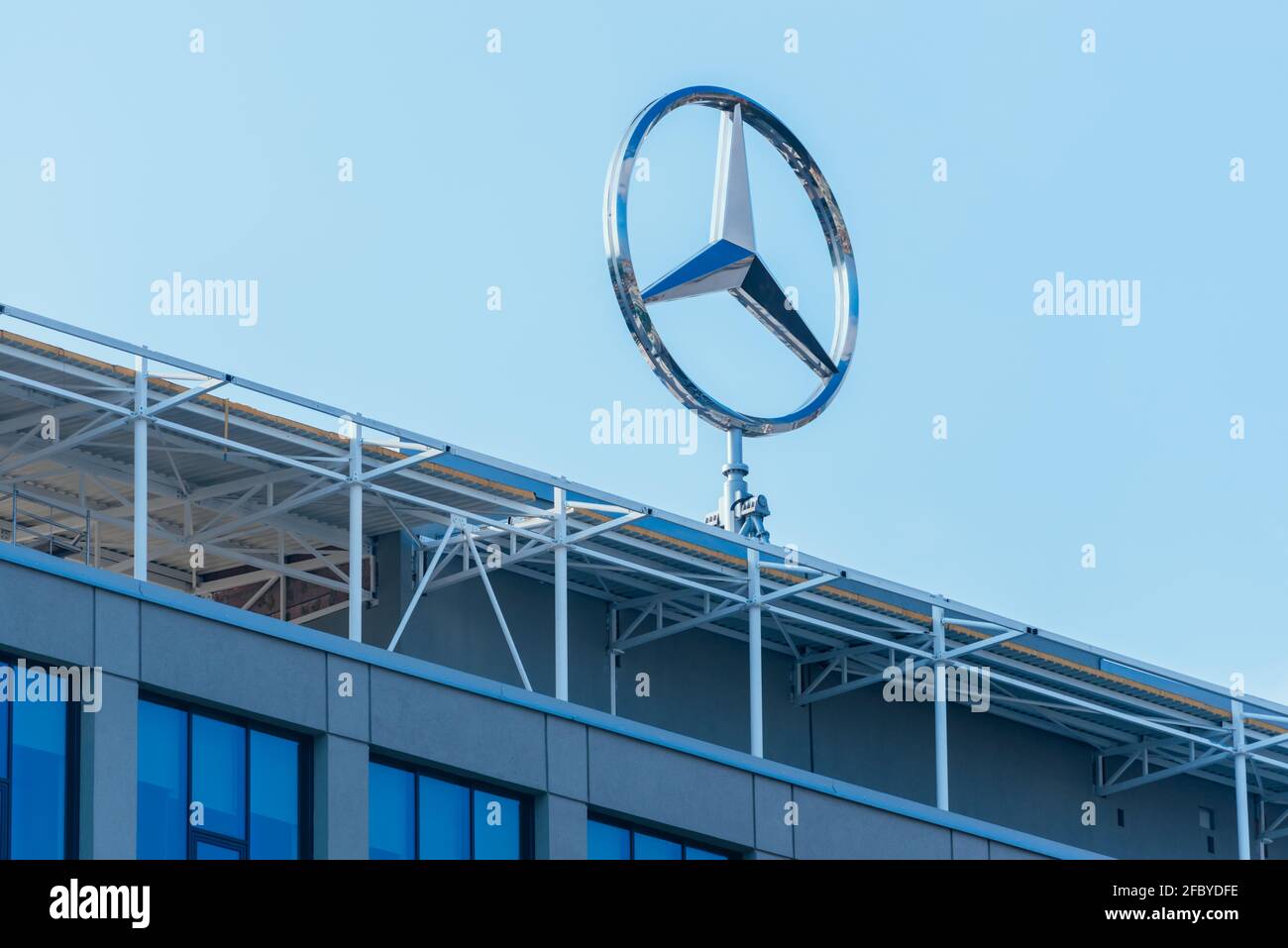Mercedes-Benz three-pointed star logo on top of a building Stock Photo ...
