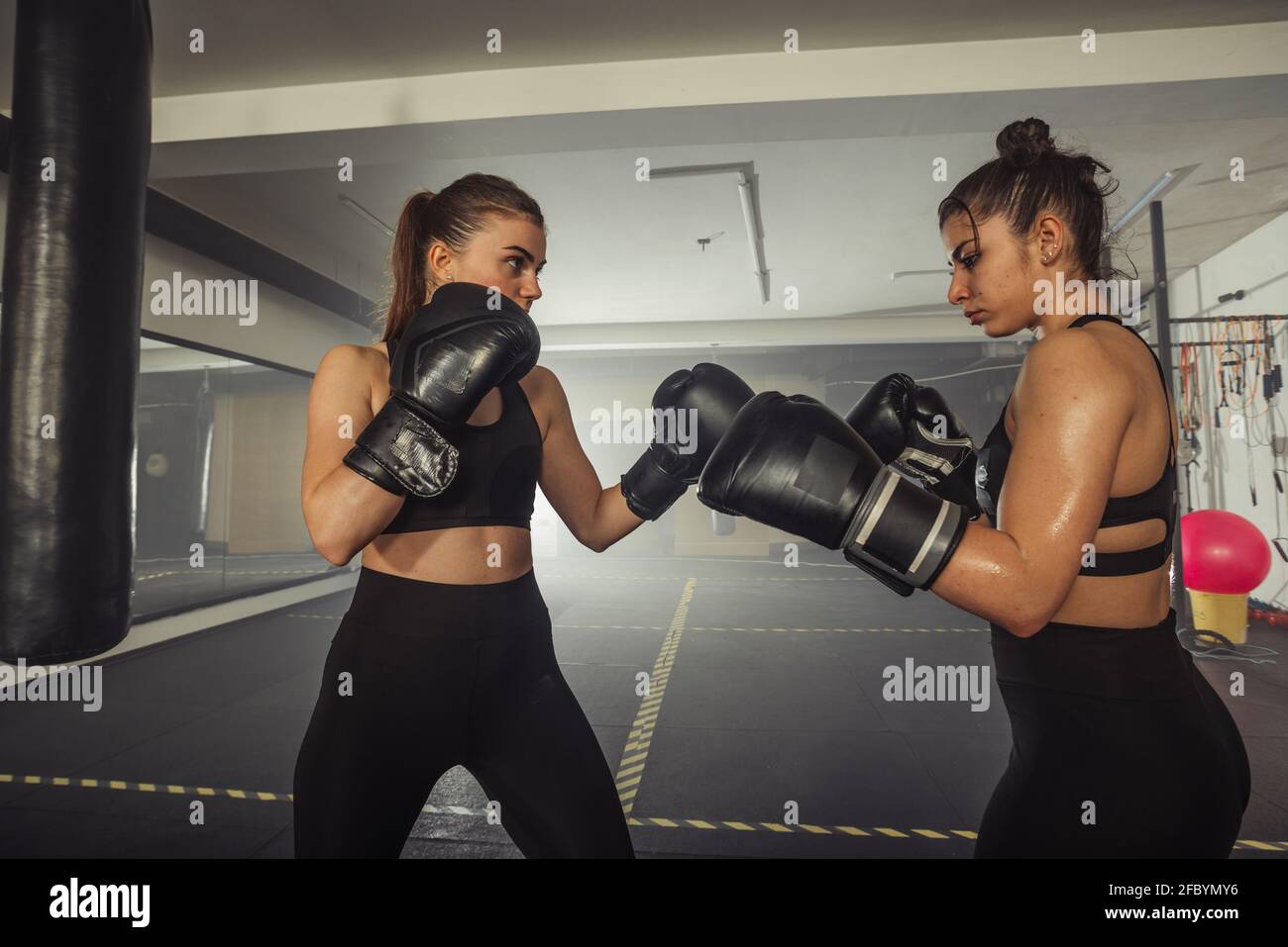 Female kickboxer doing a side kick Stock Photo - Alamy