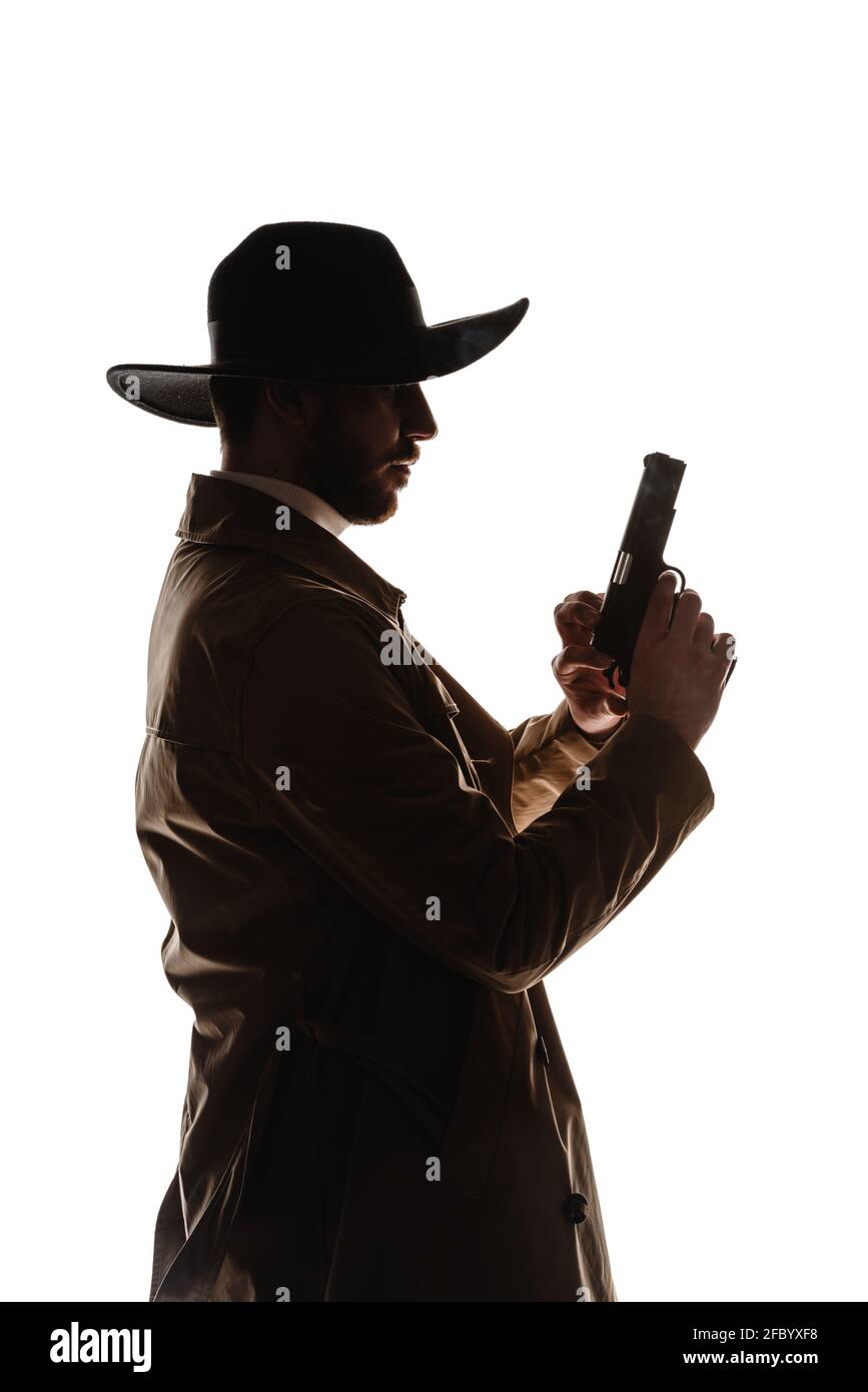 Body shot of an attractive male model posing with a weapon against ...
