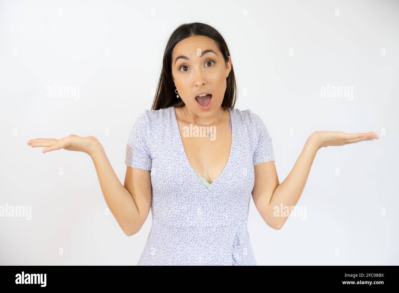Young hispanic woman wearing casual clothes clueless and confused with ...