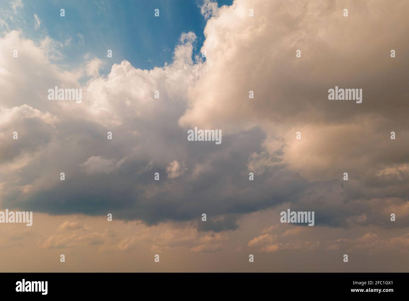 Texture of Dramatic warm cumulus clouds on the blue cold sky is a ...