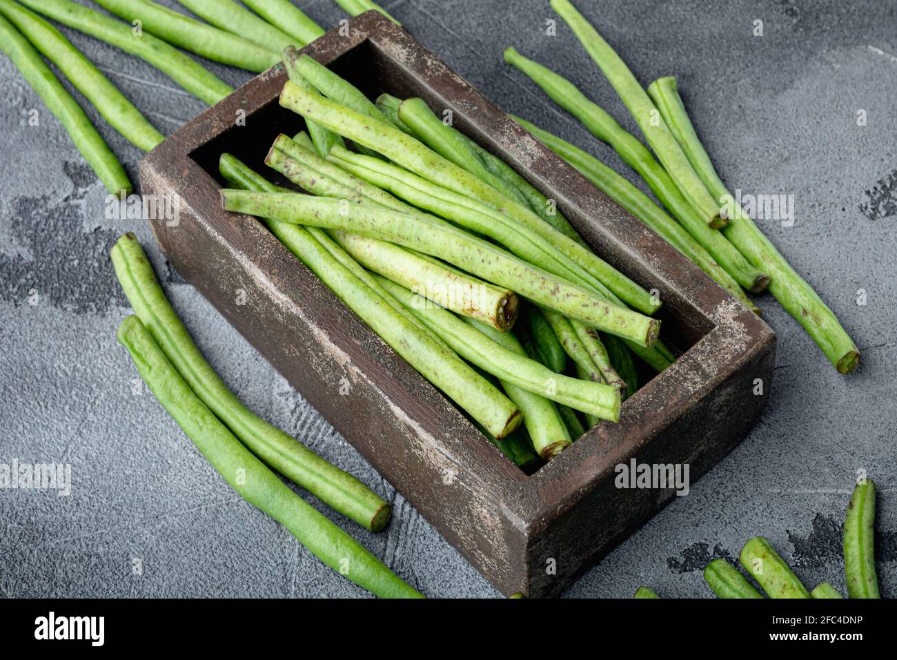 Green string bean set, in wooden box, on gray stone background Stock ...