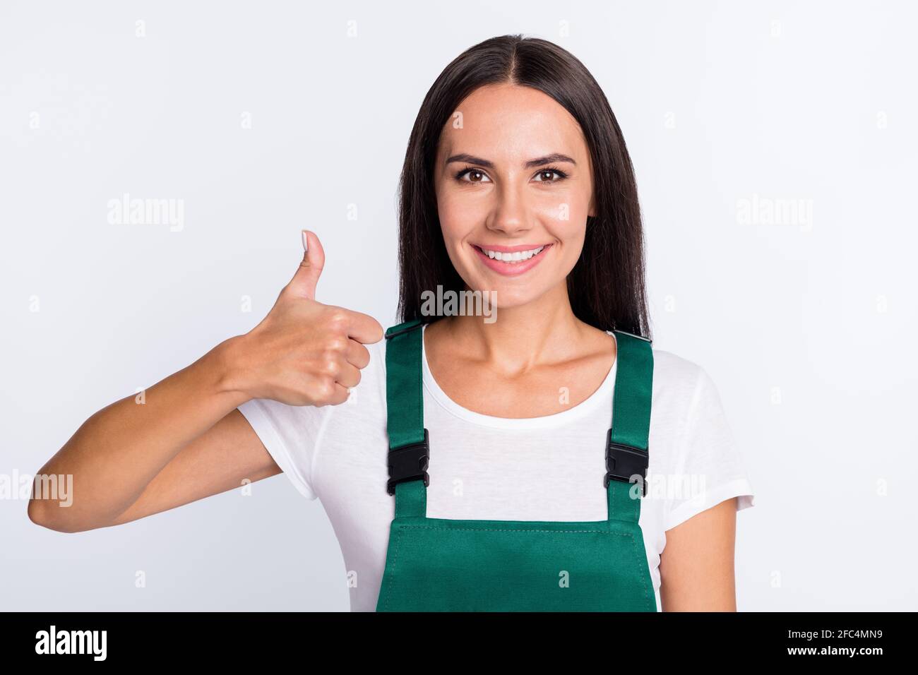 Photo of cute promoter lady shiny smile raise thumb up wear green ...