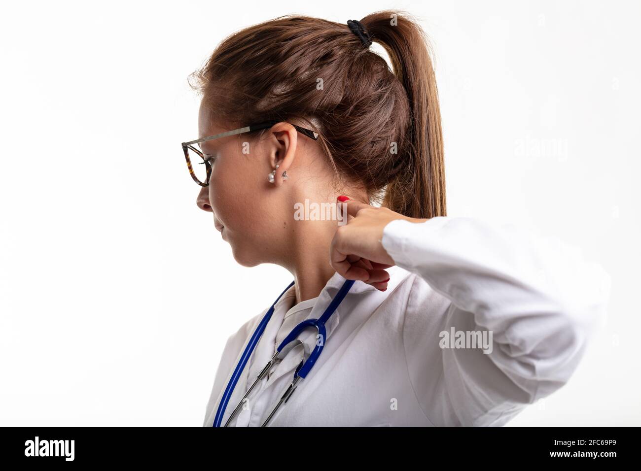 Female doctor or nursing wearing a stethoscope turning away pointing to ...