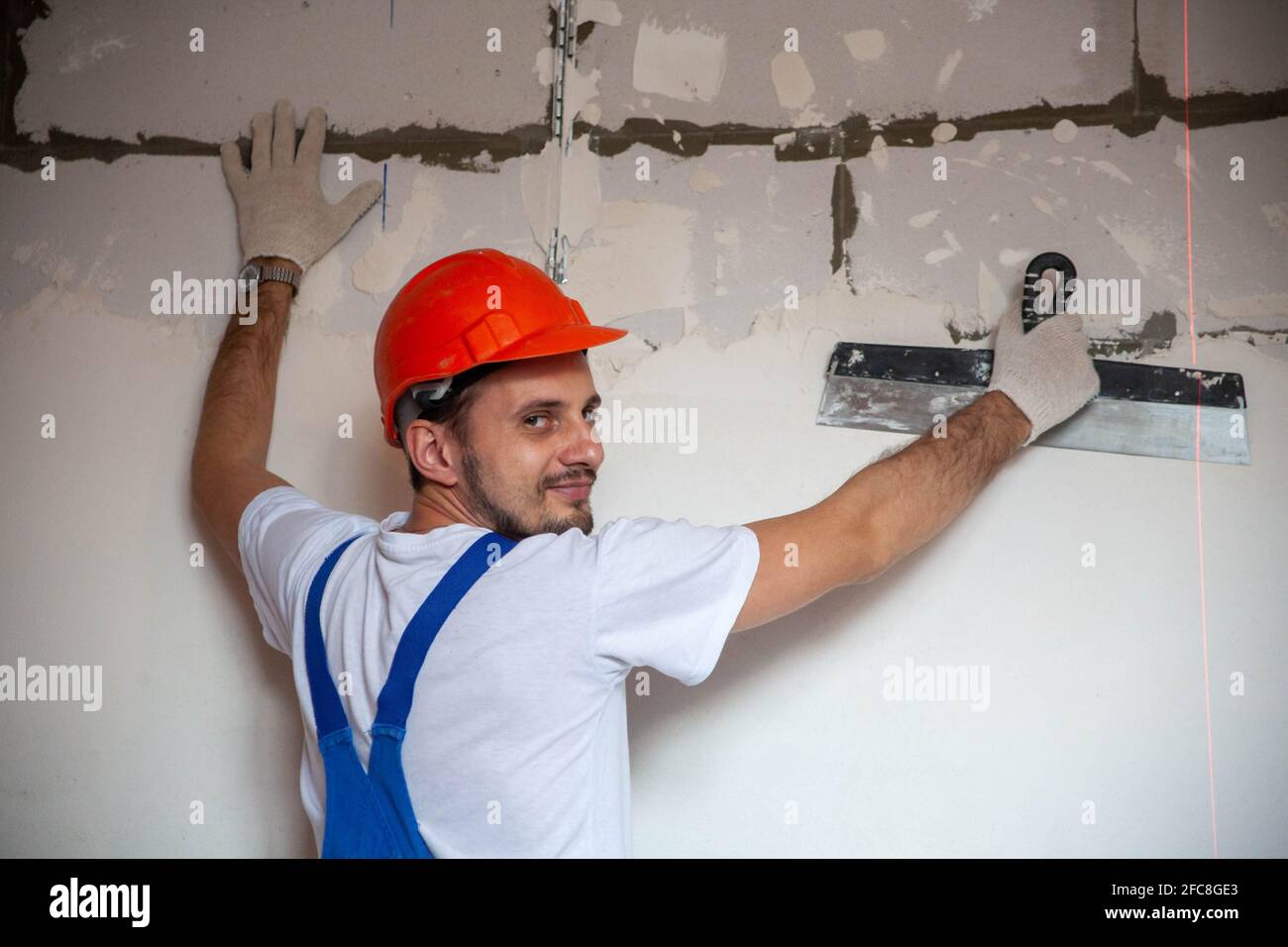 work on finishing the walls with mixtures of plaster and putty when ...