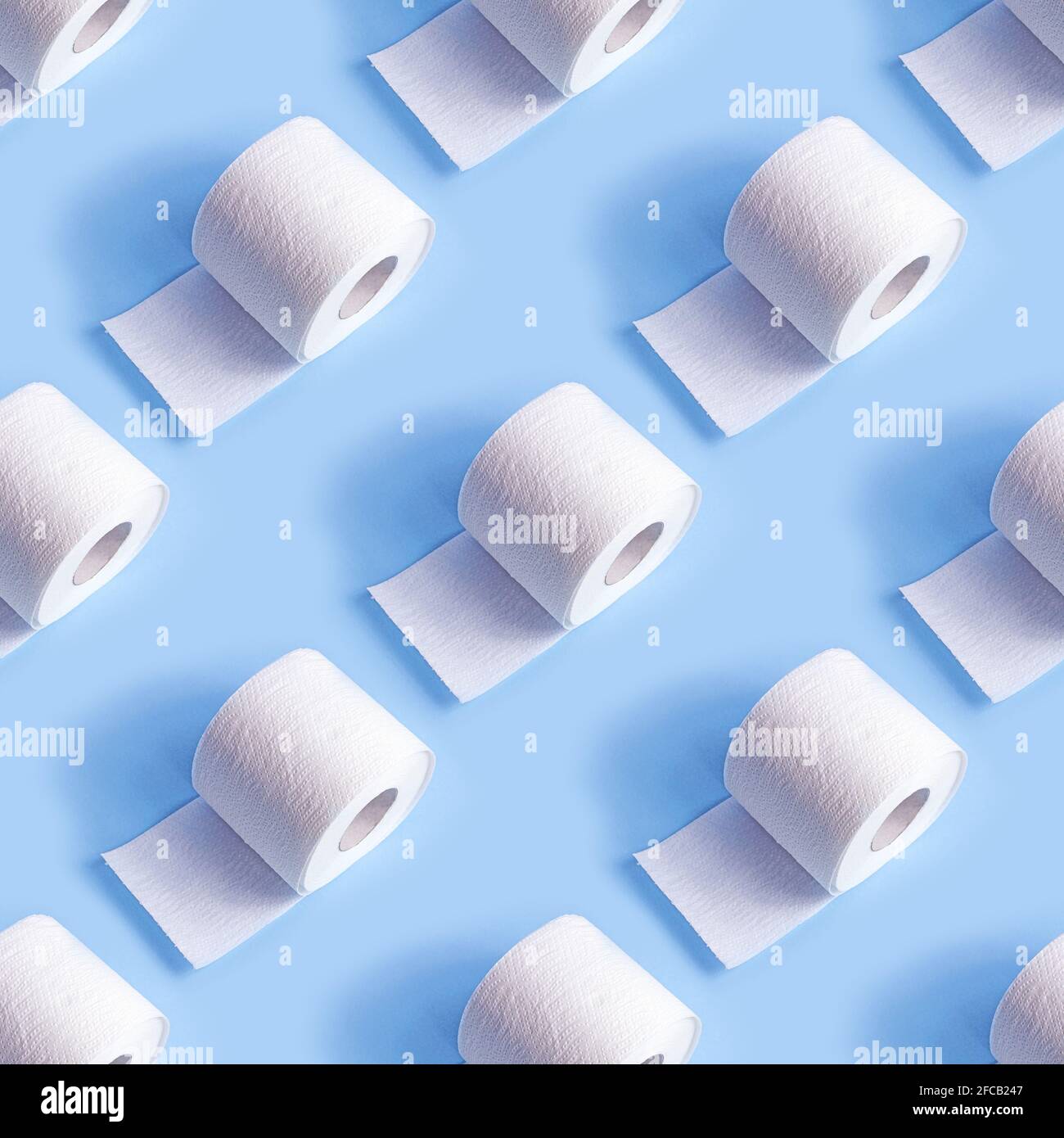 White toilet paper roll repeat seamless pattern on light blue ...
