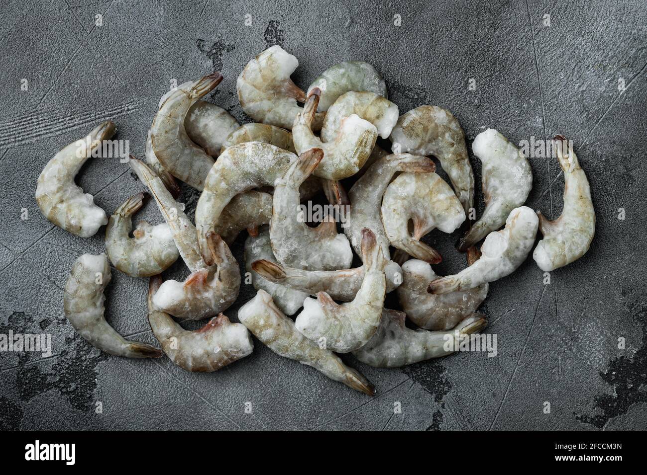 Frozen shell on Tiger Prawns or Asian tiger Shrimps set, on gray stone ...