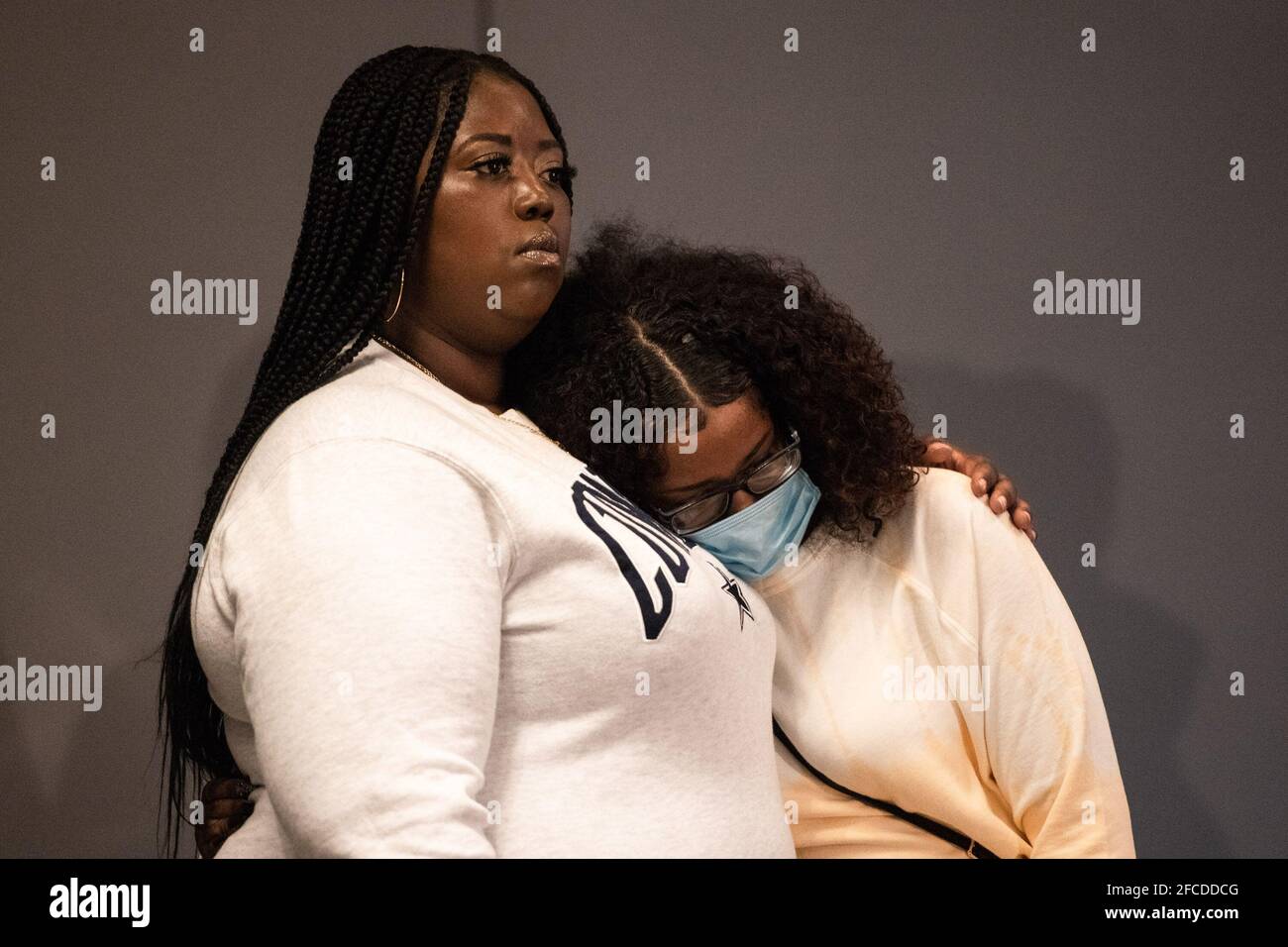 Chyna Whitaker rests her head on her cousin, Rachel Chadwick during a ...