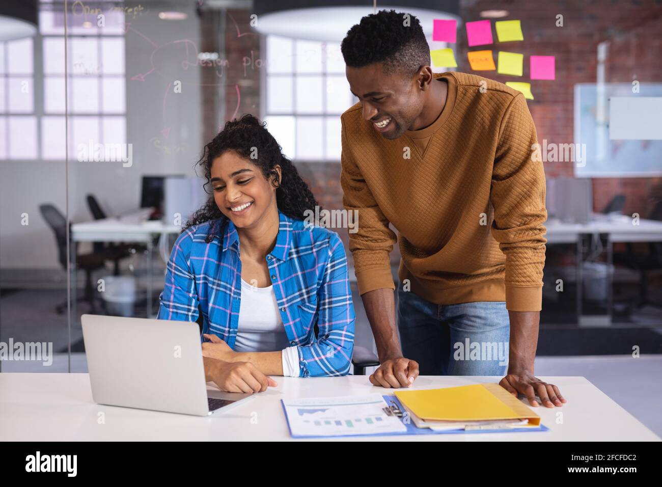 Diverse male female colleagues looking hi-res stock photography and ...