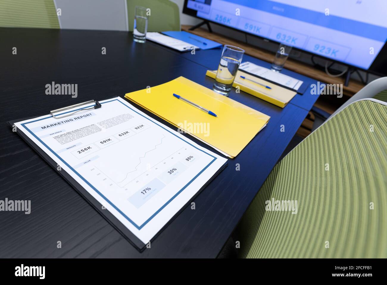 Office table with computer monitor documents and glasses of water Stock ...
