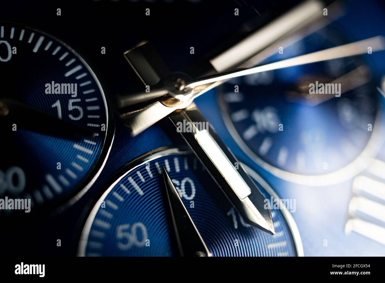 Macro Close Up of Watch Hands on Blue Faced Chronograph Stock Photo - Alamy