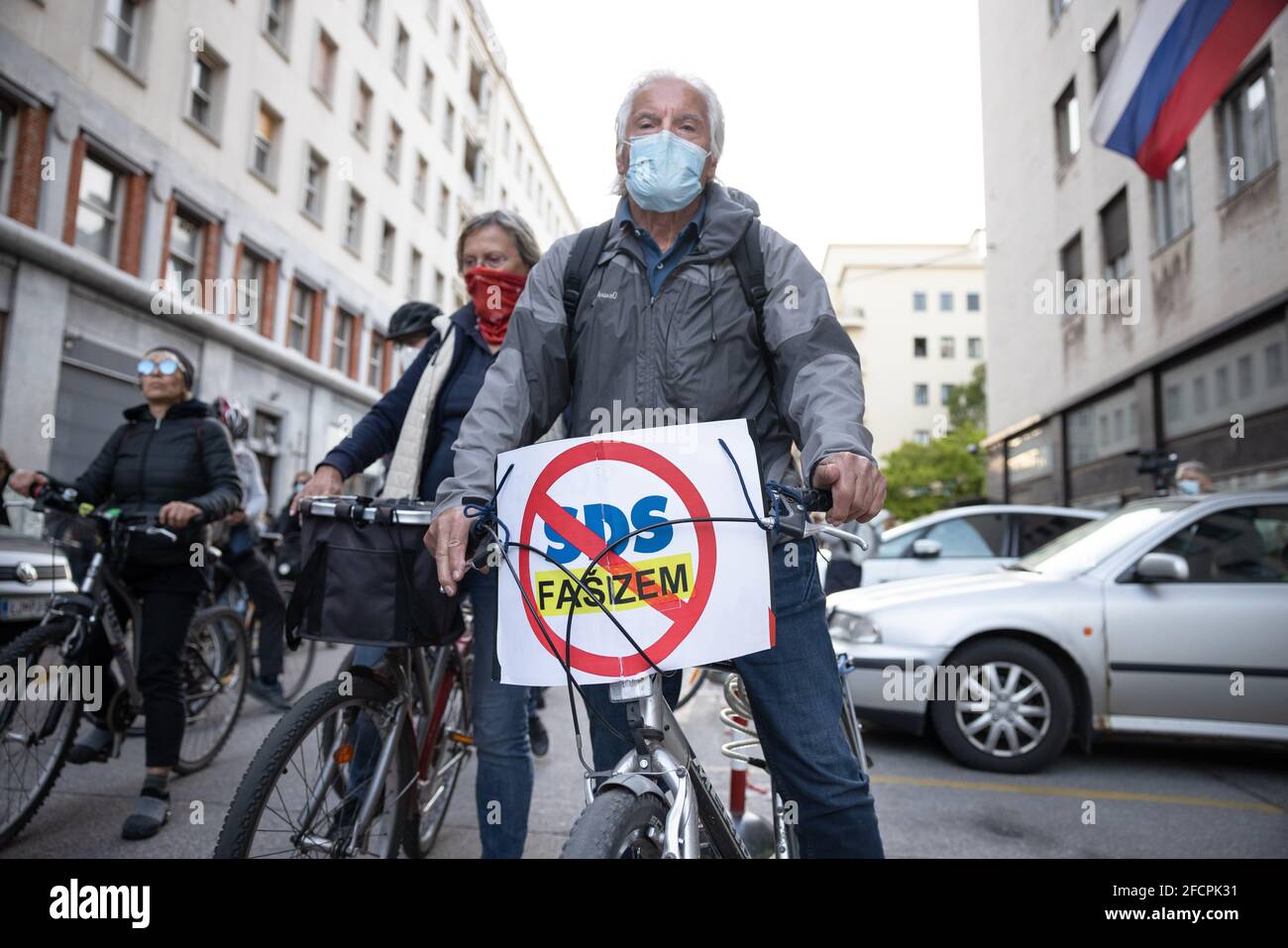 Ljubljana, Slovenia. 23rd Apr, 2021. A protester rides a bicycle fitted ...