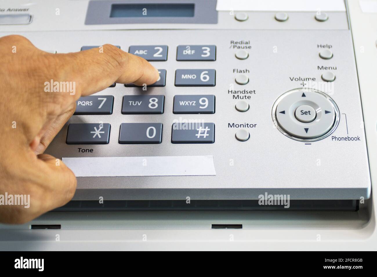 hand man are using a fax machine in the office, equipment for data ...