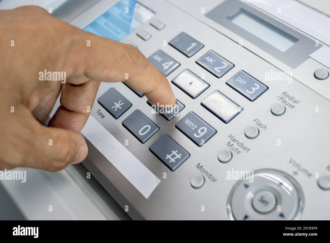 hand man are using a fax machine in the office, equipment for data ...