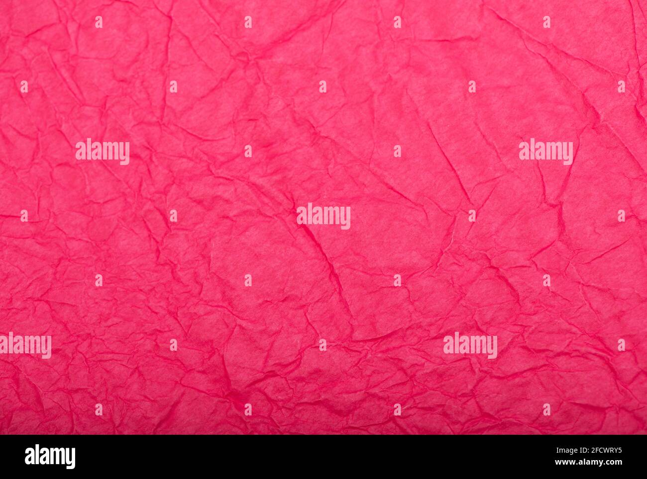 Pink crumpled paper texture or background Stock Photo - Alamy