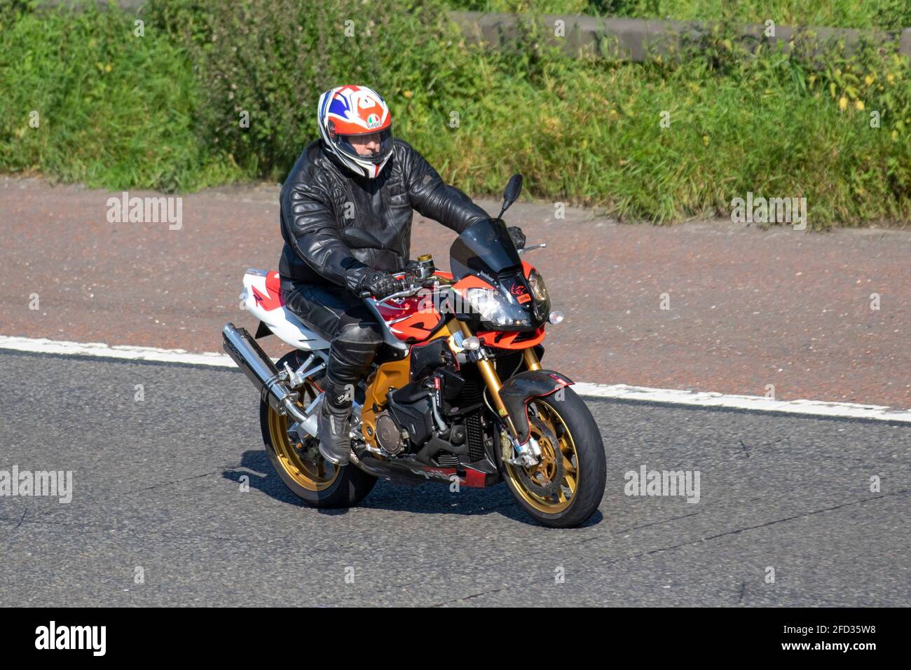 Aprilia orange Motorbike rider; two wheeled transport, motorcycles ...