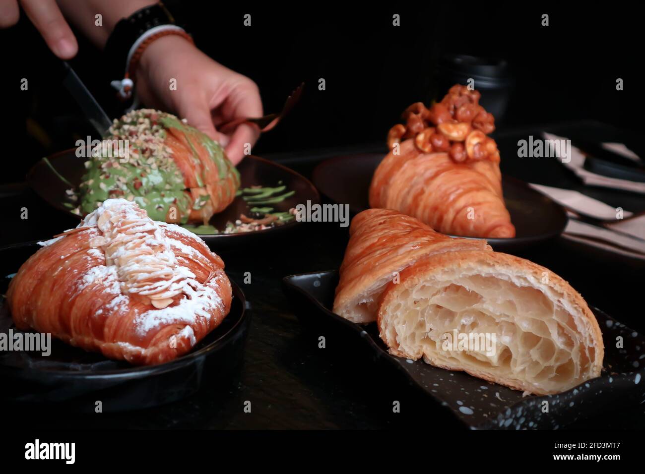 croissant, French croissant or almond croissant with icing topping ...