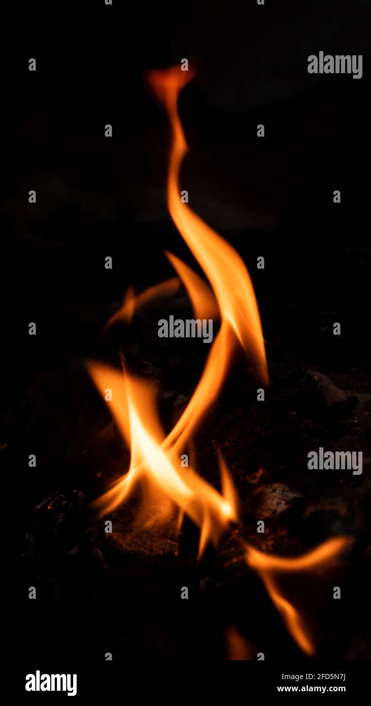 Vertical Fire pattern against black background photograph Stock Photo ...