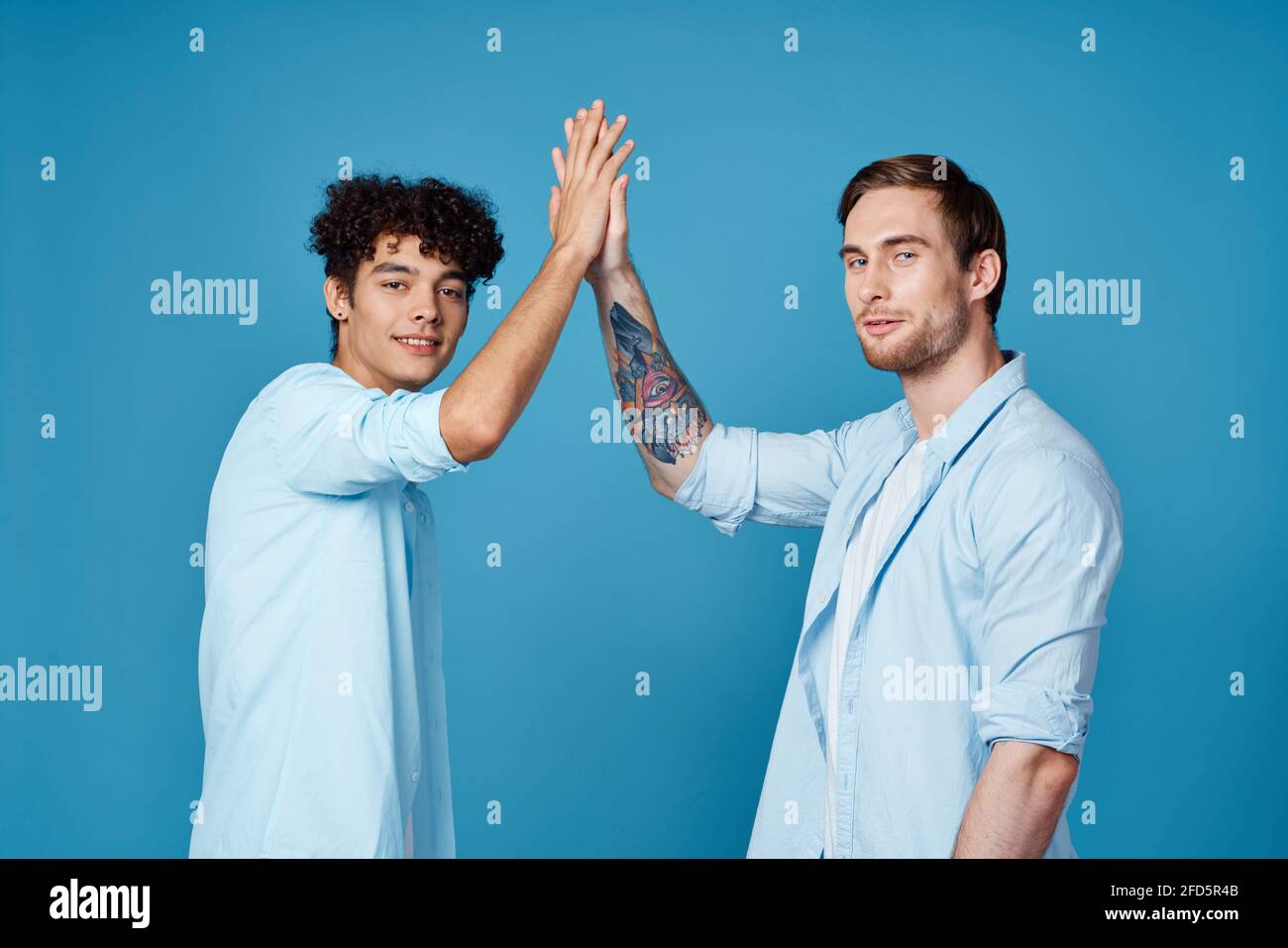 young guys in matching t-shirts and shirts fun greetings blue ...