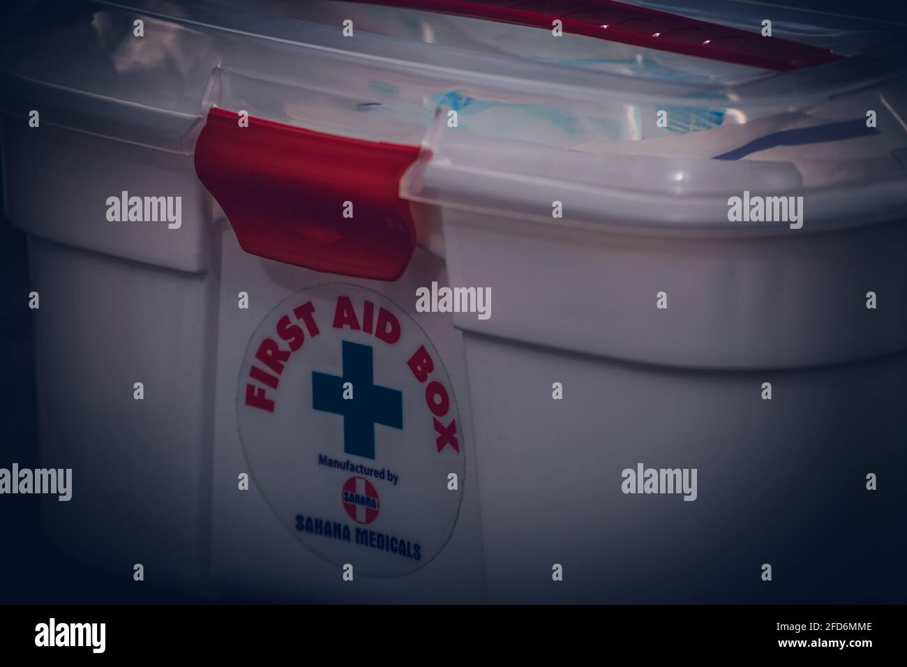 First aid box on a green-clothed tabletop front view close-up image ...