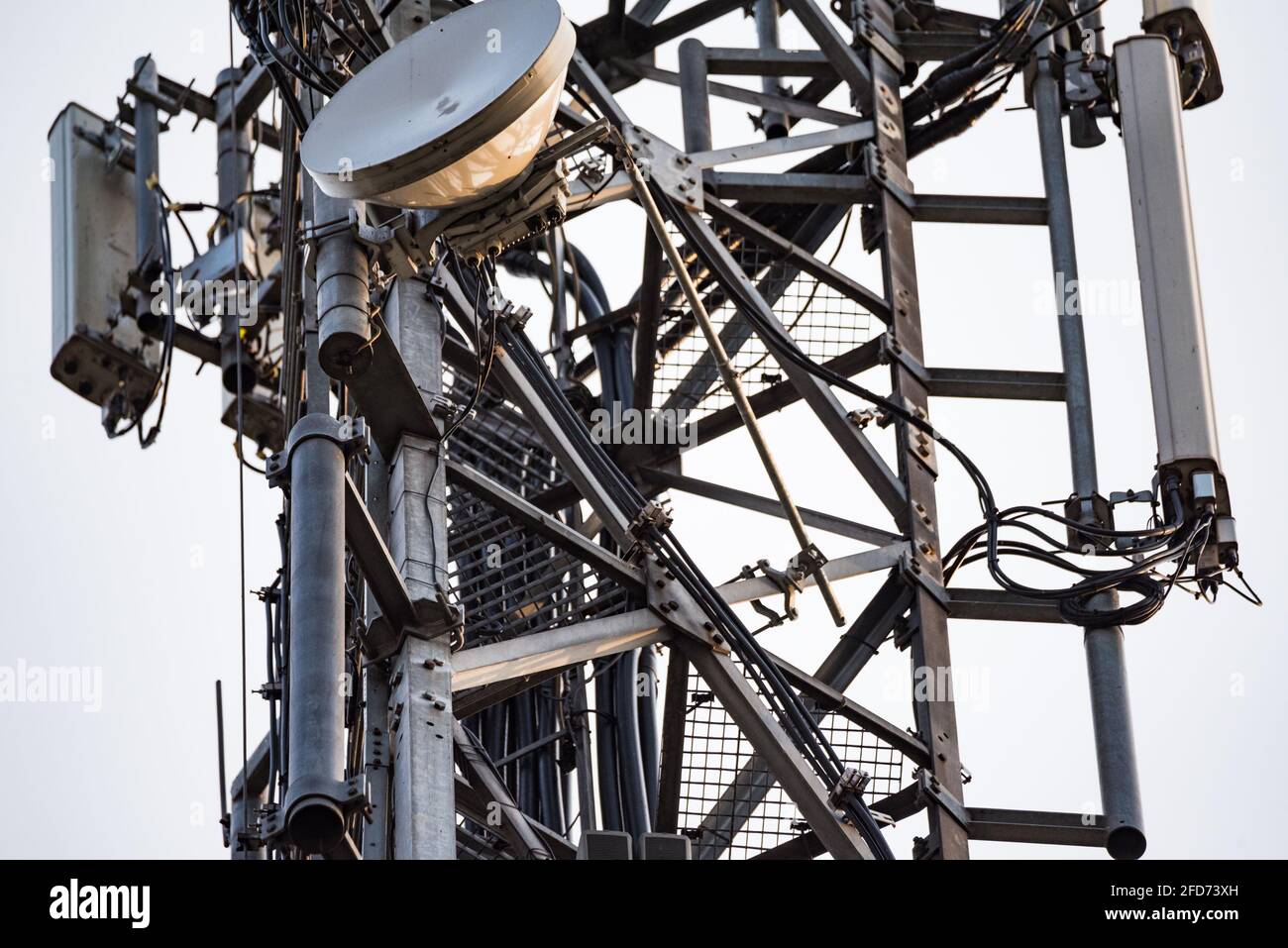 Mobile telephony base station. Metal mast structure with devices ...