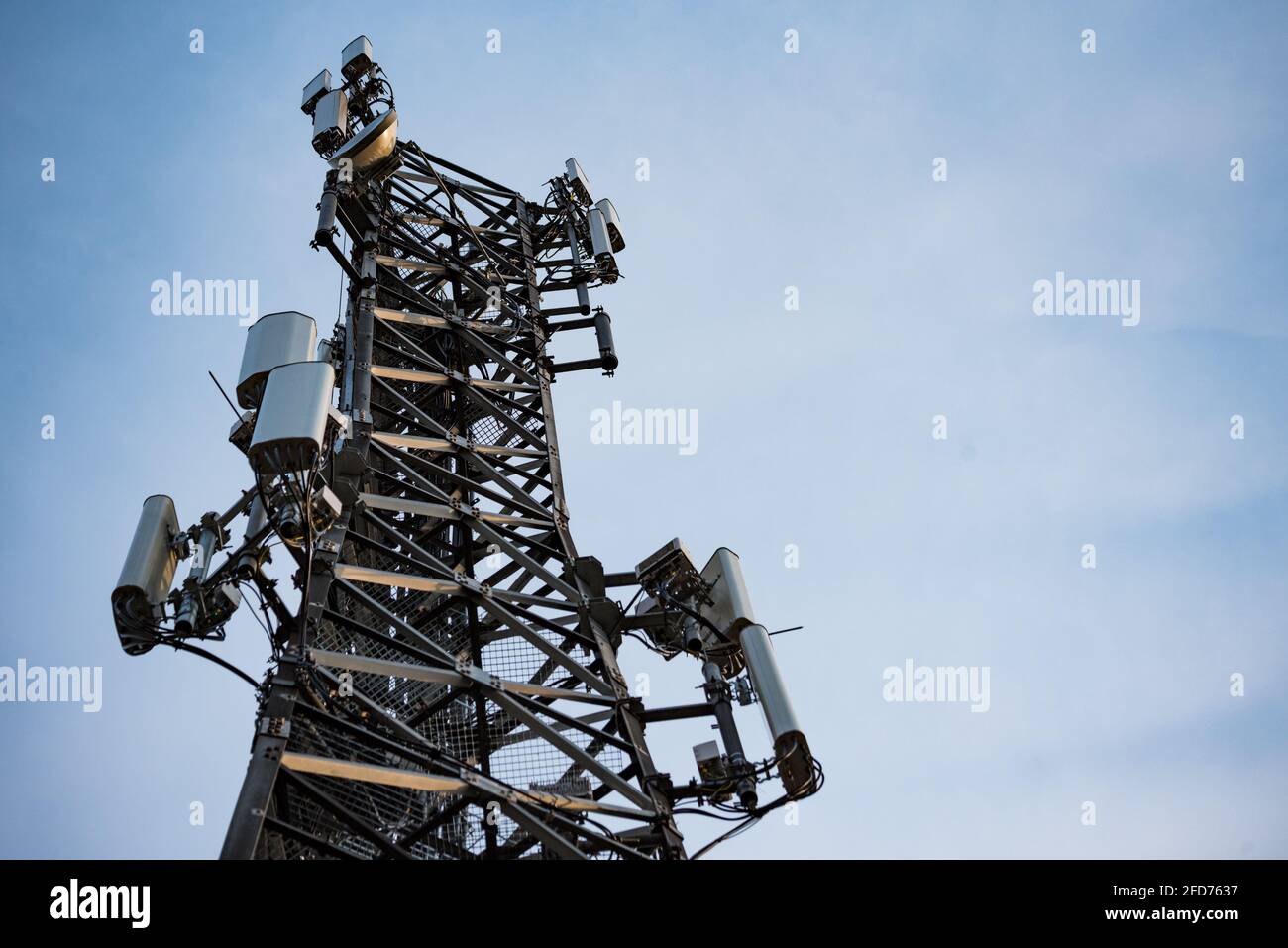 Mobile telephony base station. Metal mast structure with devices ...