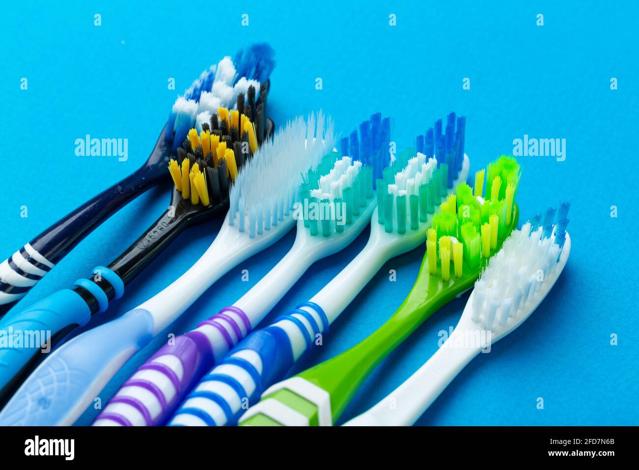 Toothbrushes on a blue background. Concept toothbrush selection. Oral ...