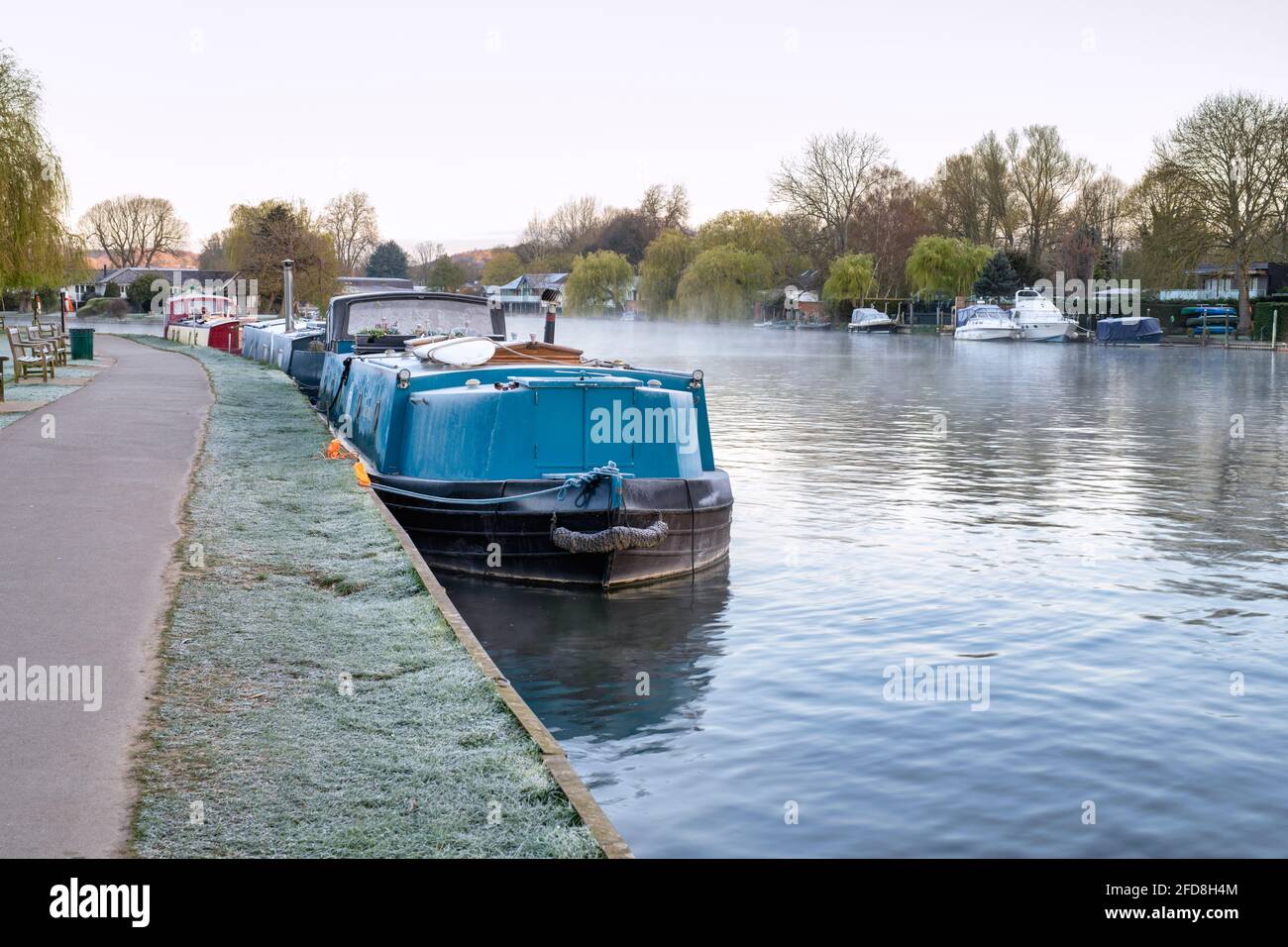 River boats on the river thames at mill meadows on a frosty spring ...