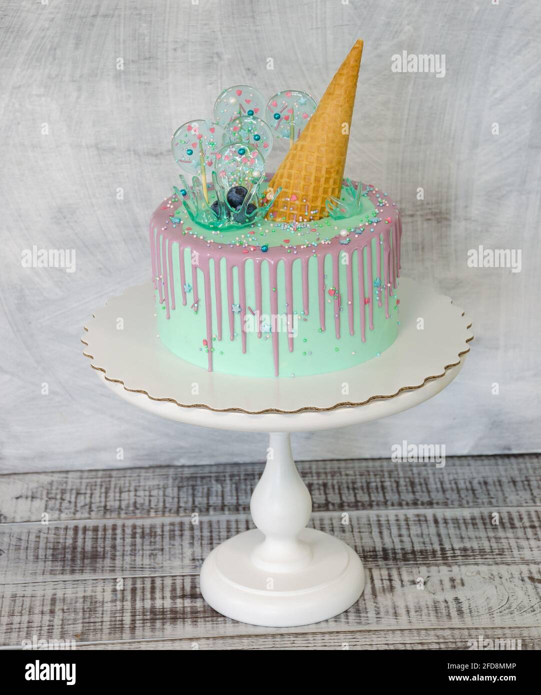 blue cake with ice cream cone and caramel decoration Stock Photo - Alamy