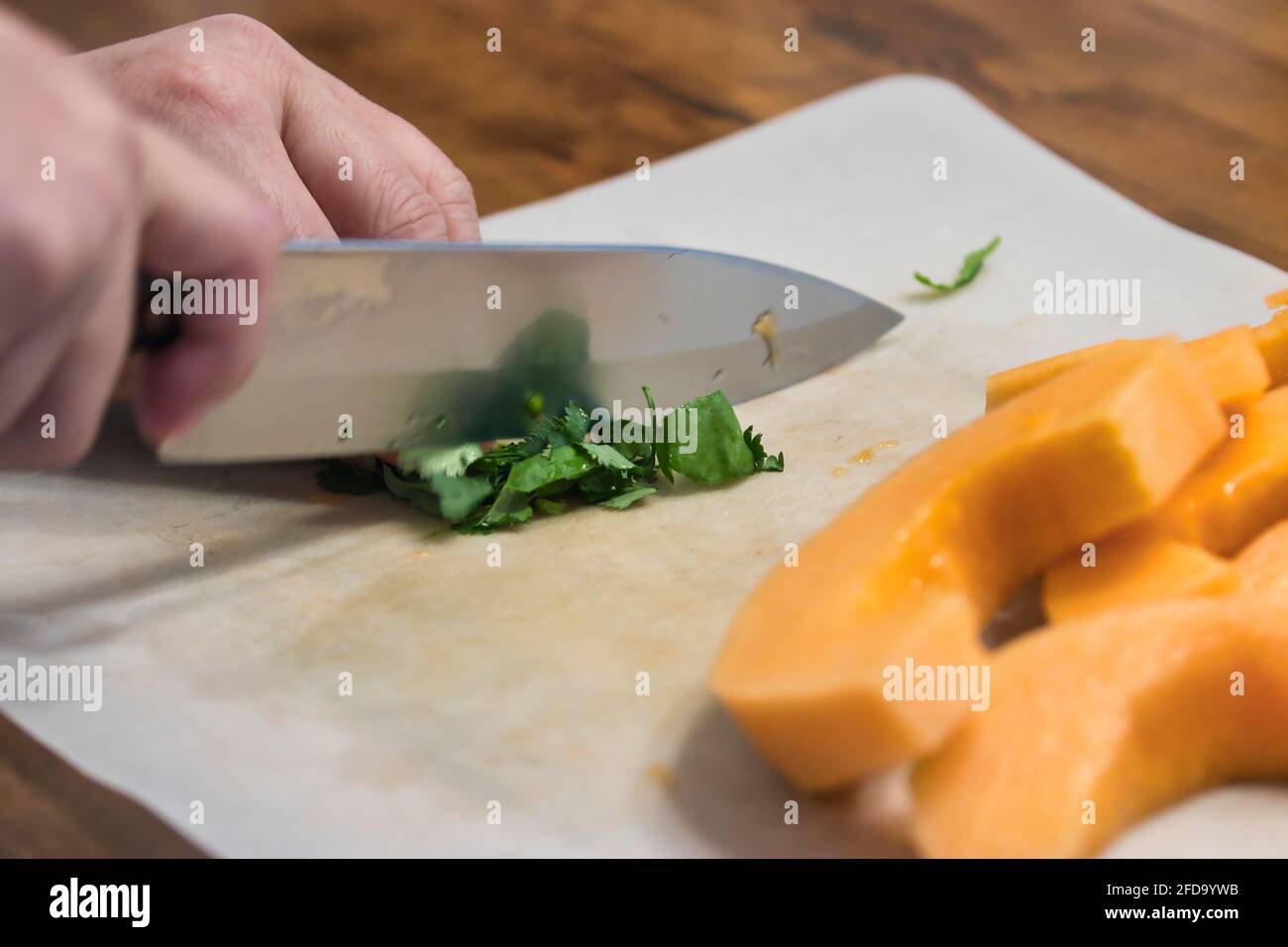 Womans hands chopping fresh green hi-res stock photography and images ...