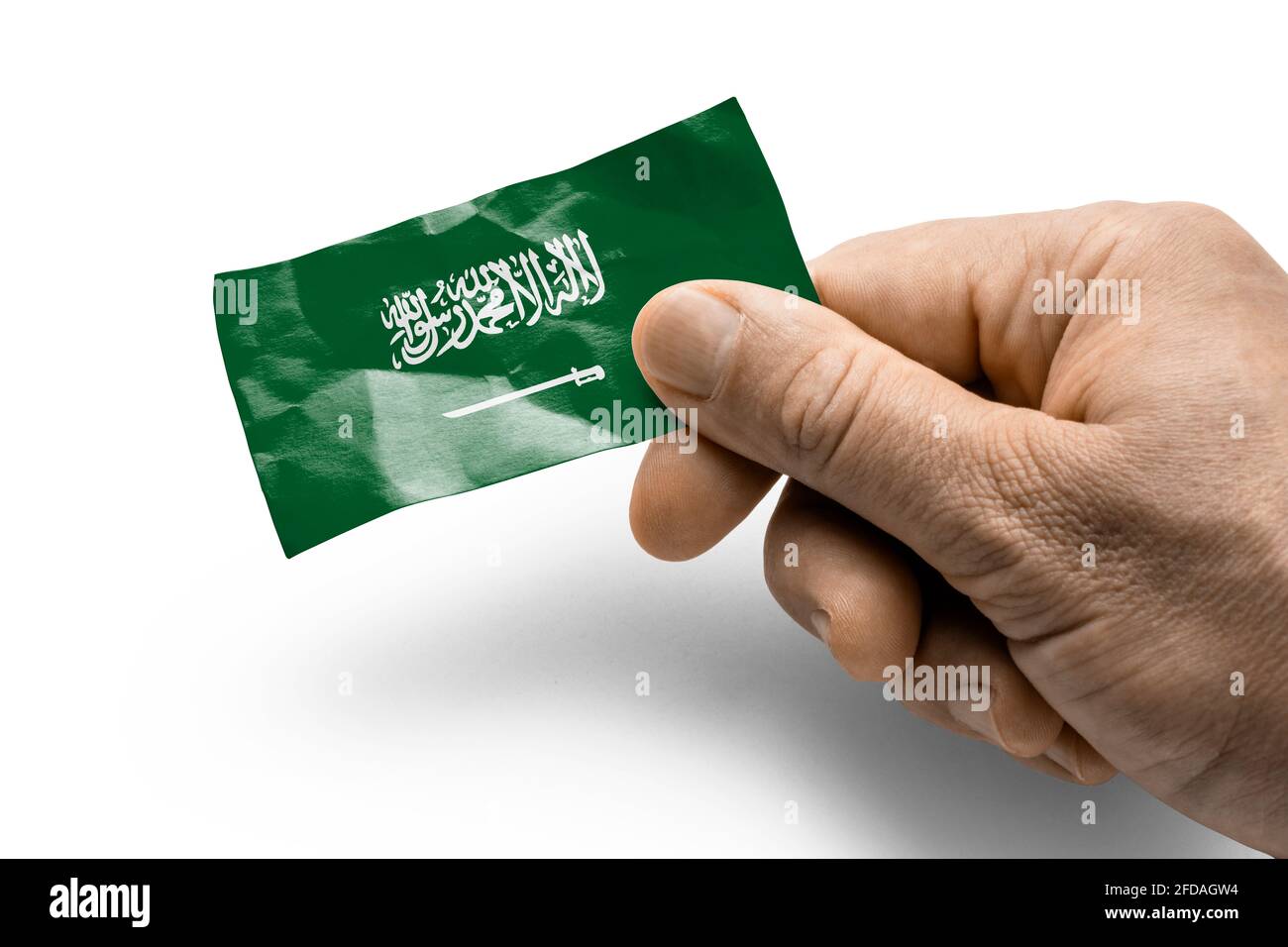 Hand holding a card with a national flag the Saudi Arabia Stock Photo ...