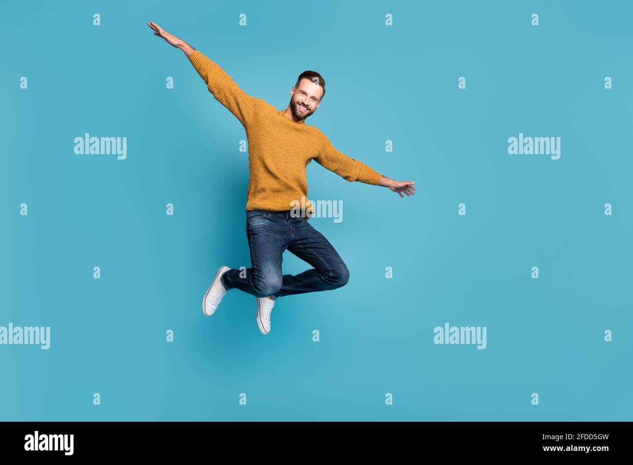 Full length body size view of attractive cheerful guy jumping having ...