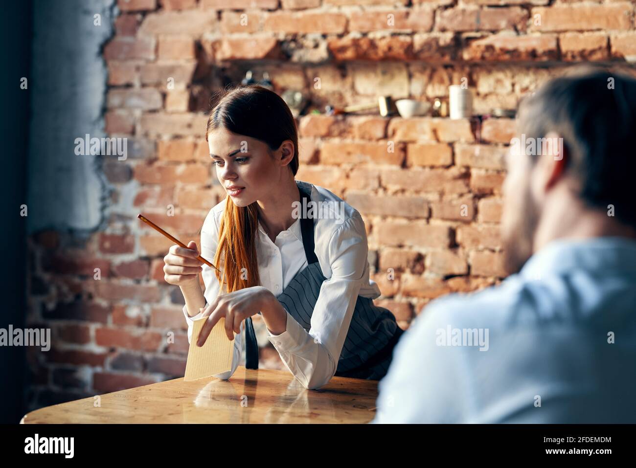 cheerful female waiter taking order restaurant service work Stock Photo ...