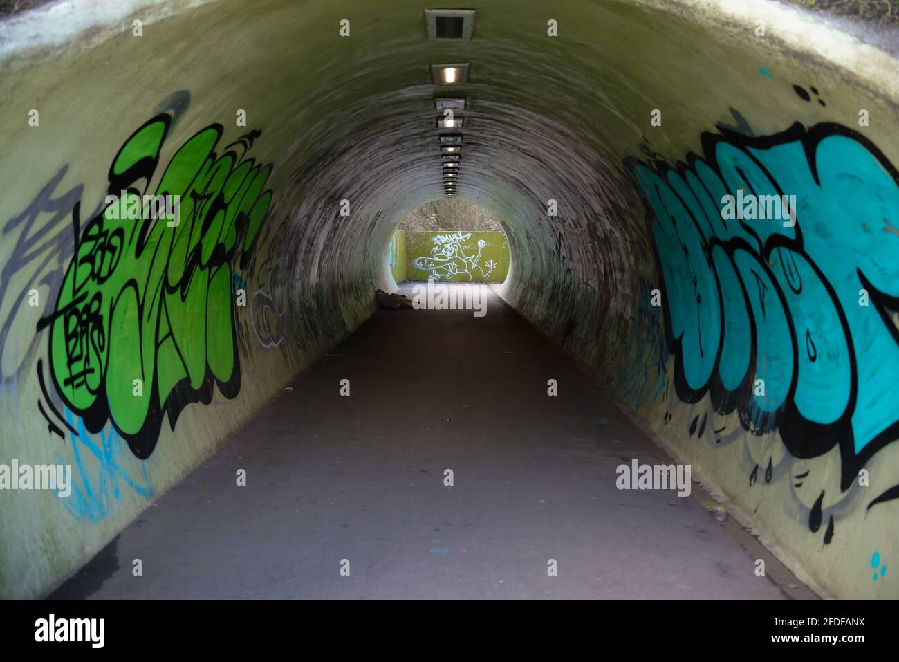 Subway, under-pass, floodlights, scary, night-time, lone traveller ...