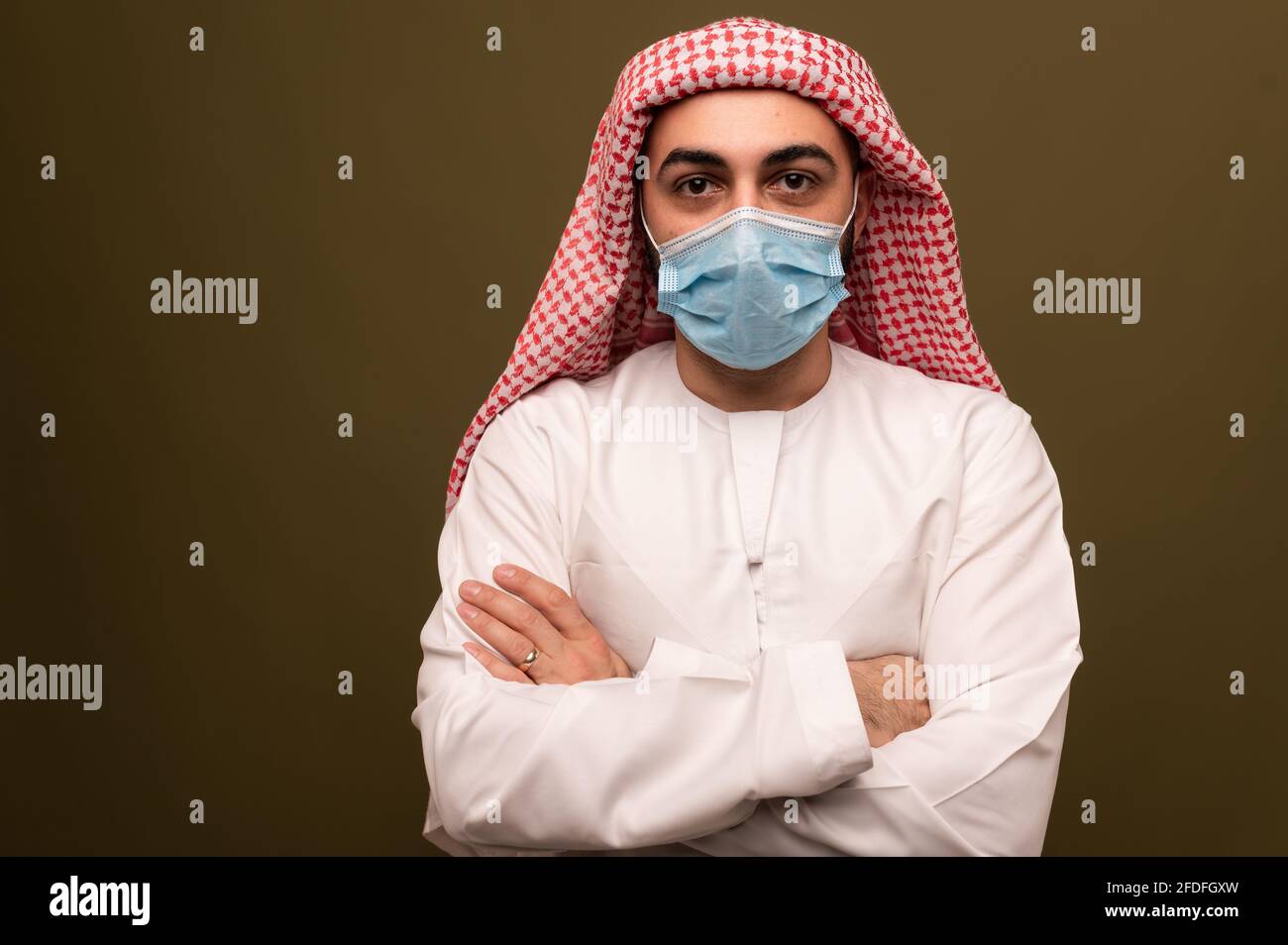 Muslim man wearing a medical mask. Portrait of a young arab man in ...