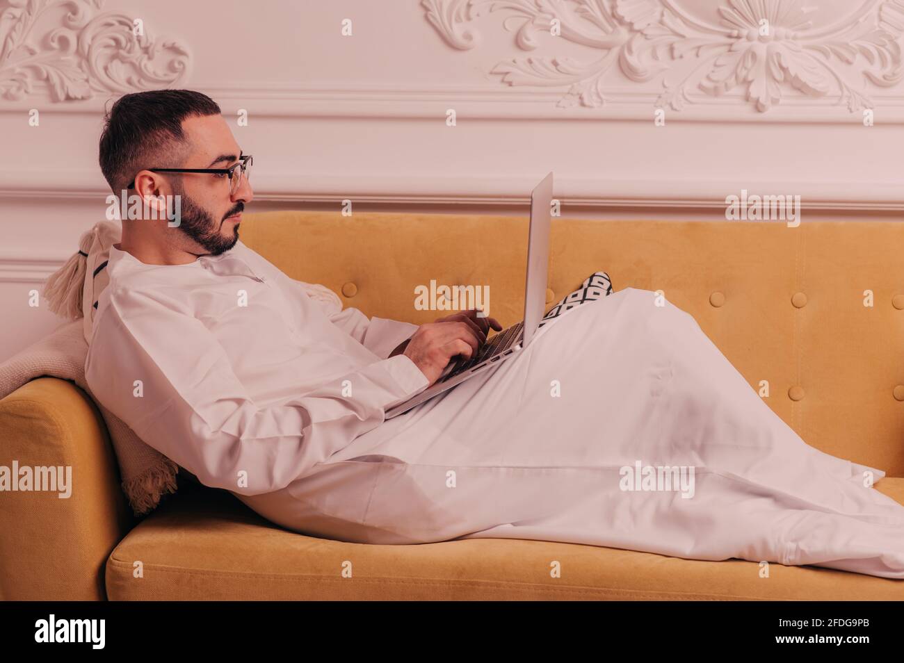 Arab businessman working on laptop computer at home Stock Photo - Alamy