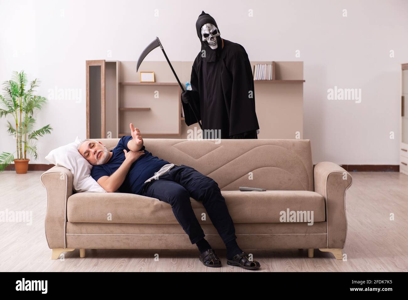 Devil coming to old dying man Stock Photo - Alamy