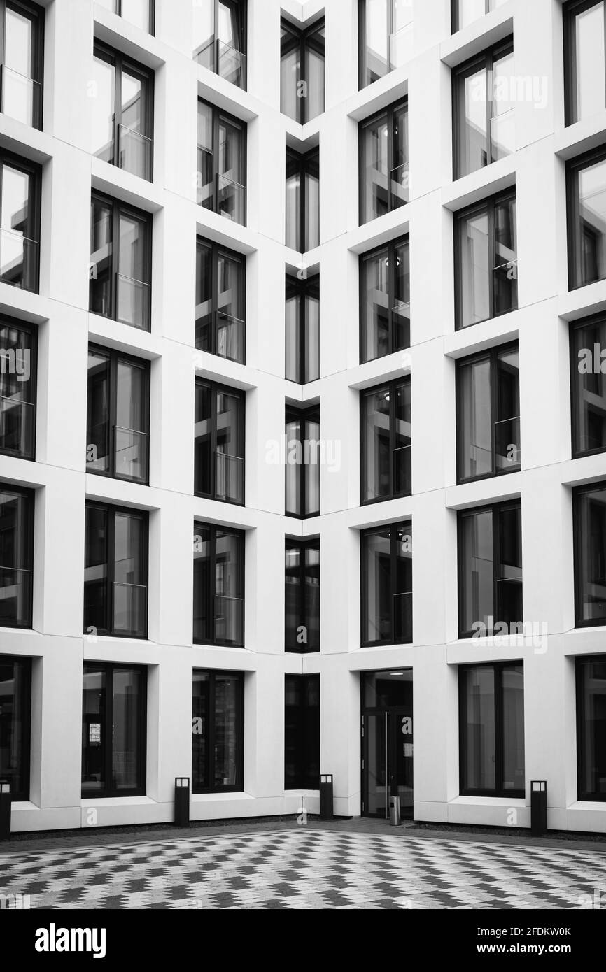 Vertical grayscale shot of a high-rise building Stock Photo - Alamy