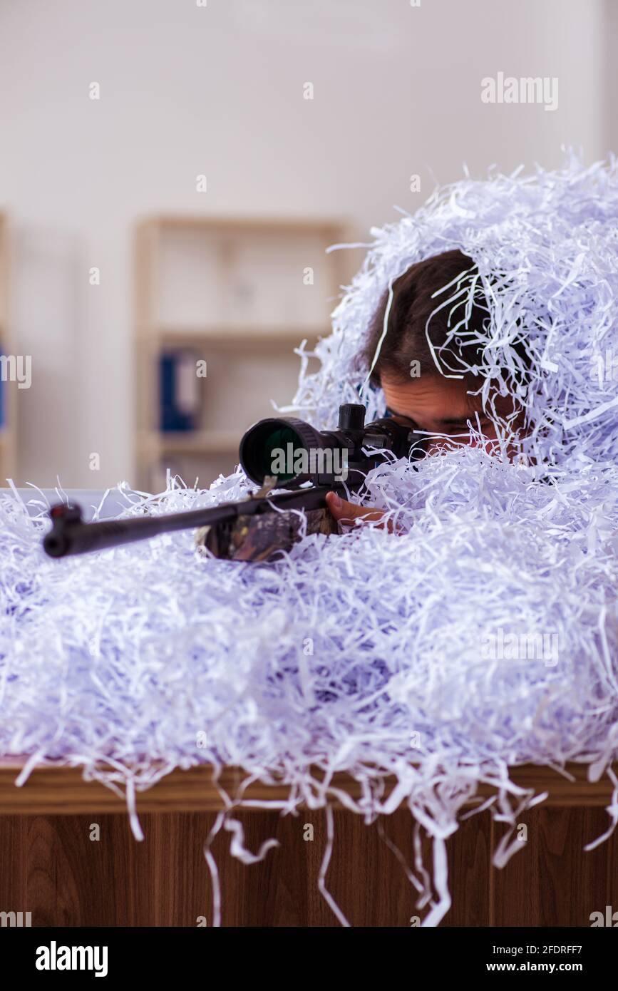 Young businessman employee and a lot of cut papers in the office Stock ...